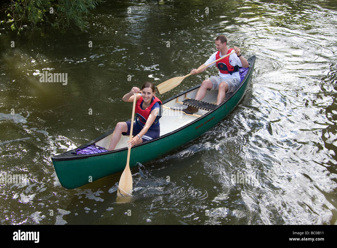 canadian canoeists fish pass canoeing canoe river medway kent england ...