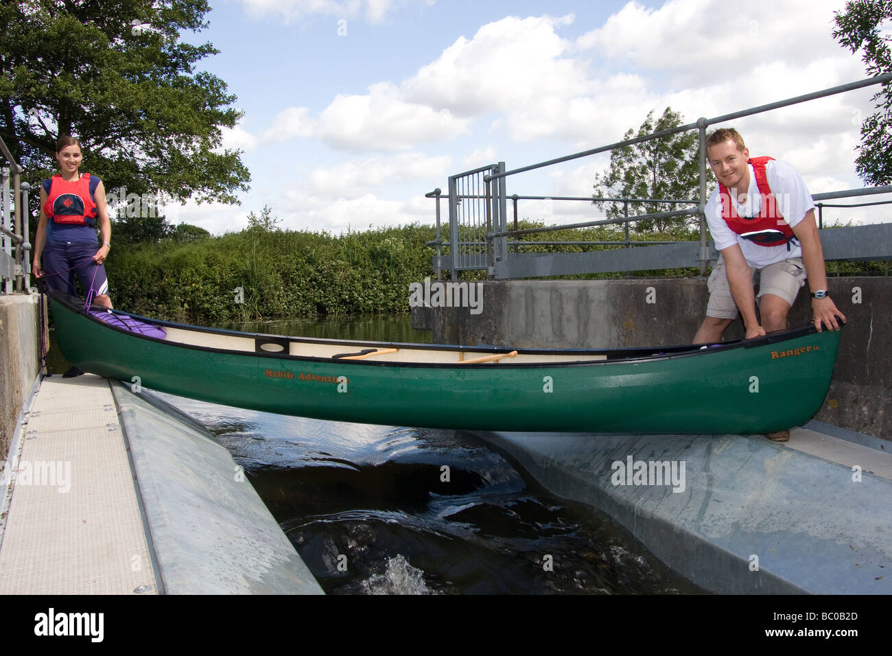 canadian canoeists fish pass canoeing canoe river medway kent england ...