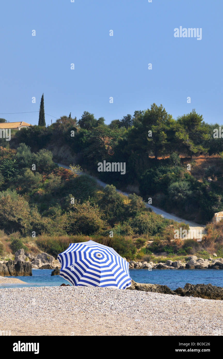 blue white striped parasol at the beach Stock Photo - Alamy