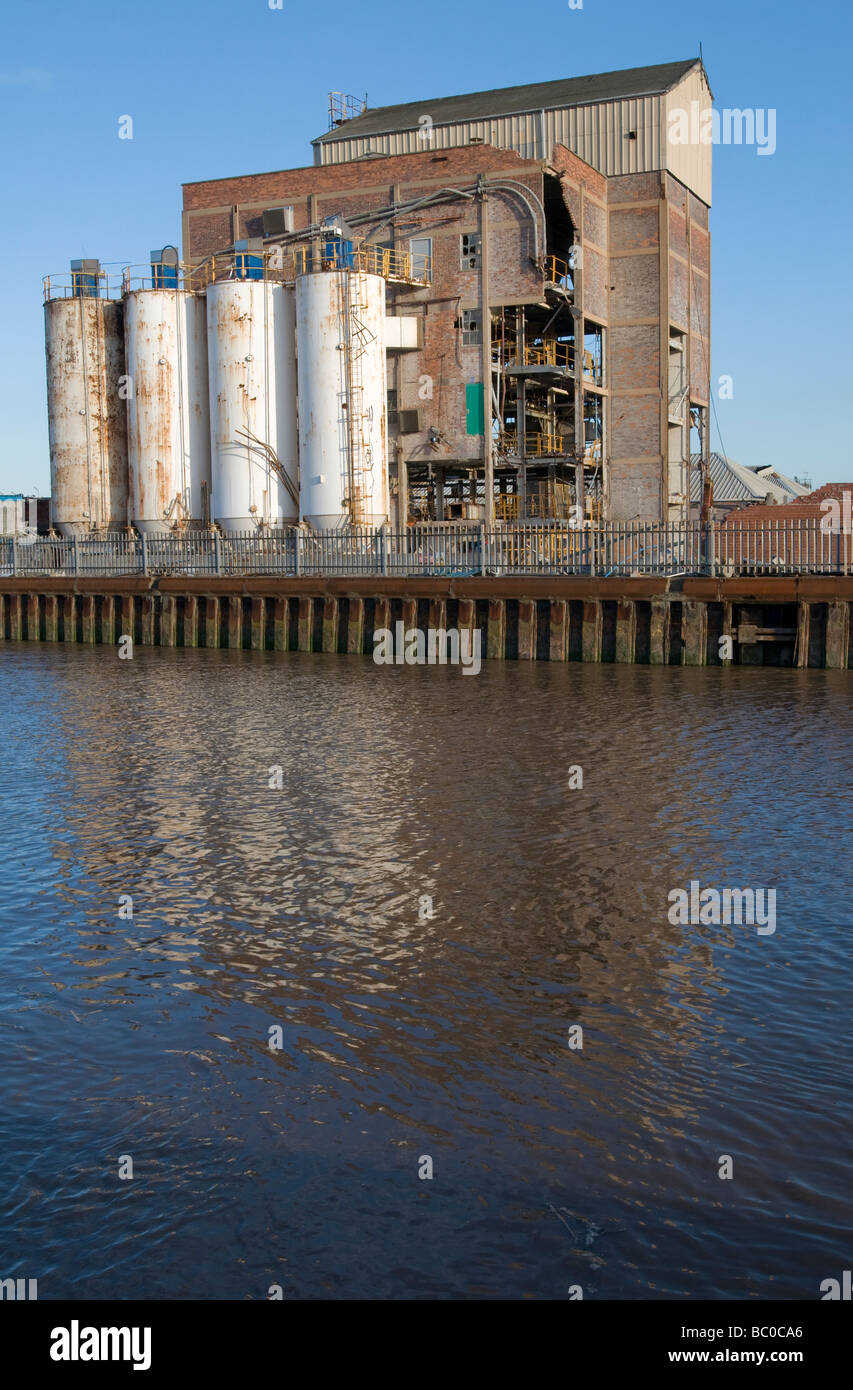 Disused and partly demolished factory building on the River Hull ...