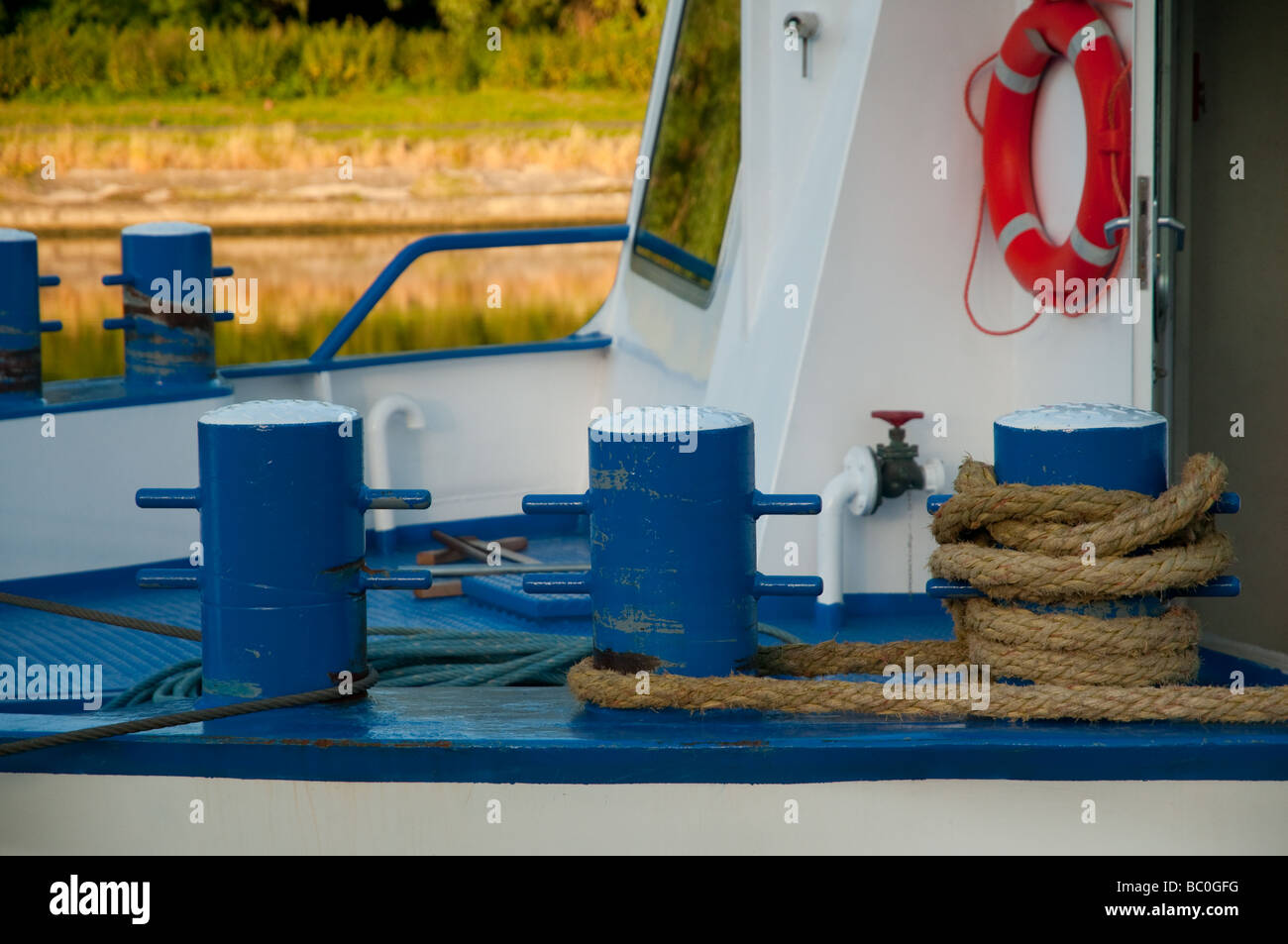 tie up the blue boat with the ropes Stock Photo - Alamy