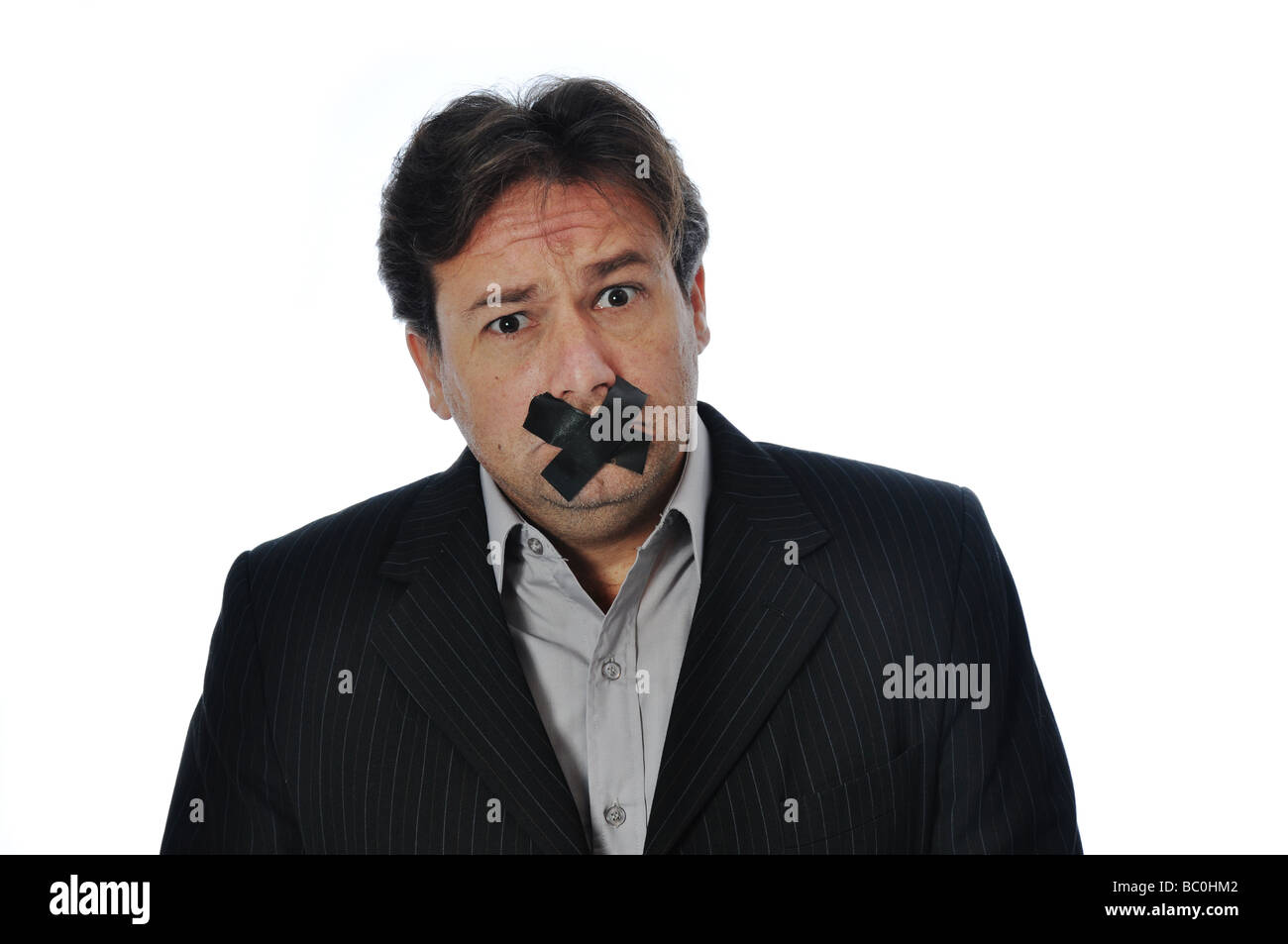 Studio Shot of Business Man told to shut up Stock Photo - Alamy