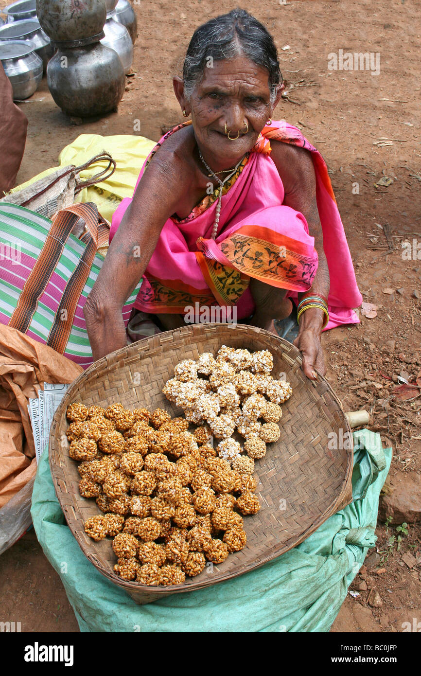 Indian Woman Of The Paroja Tribe Selling Sweet Pastries, Orissa Stock ...