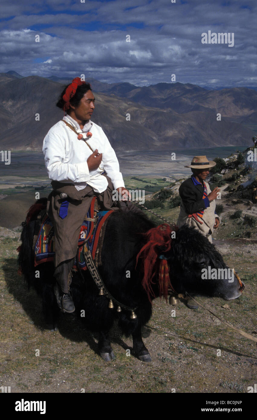 monastery Tibetan Buddhist pilgrim on yak dzo dressed up outside Ganden ...