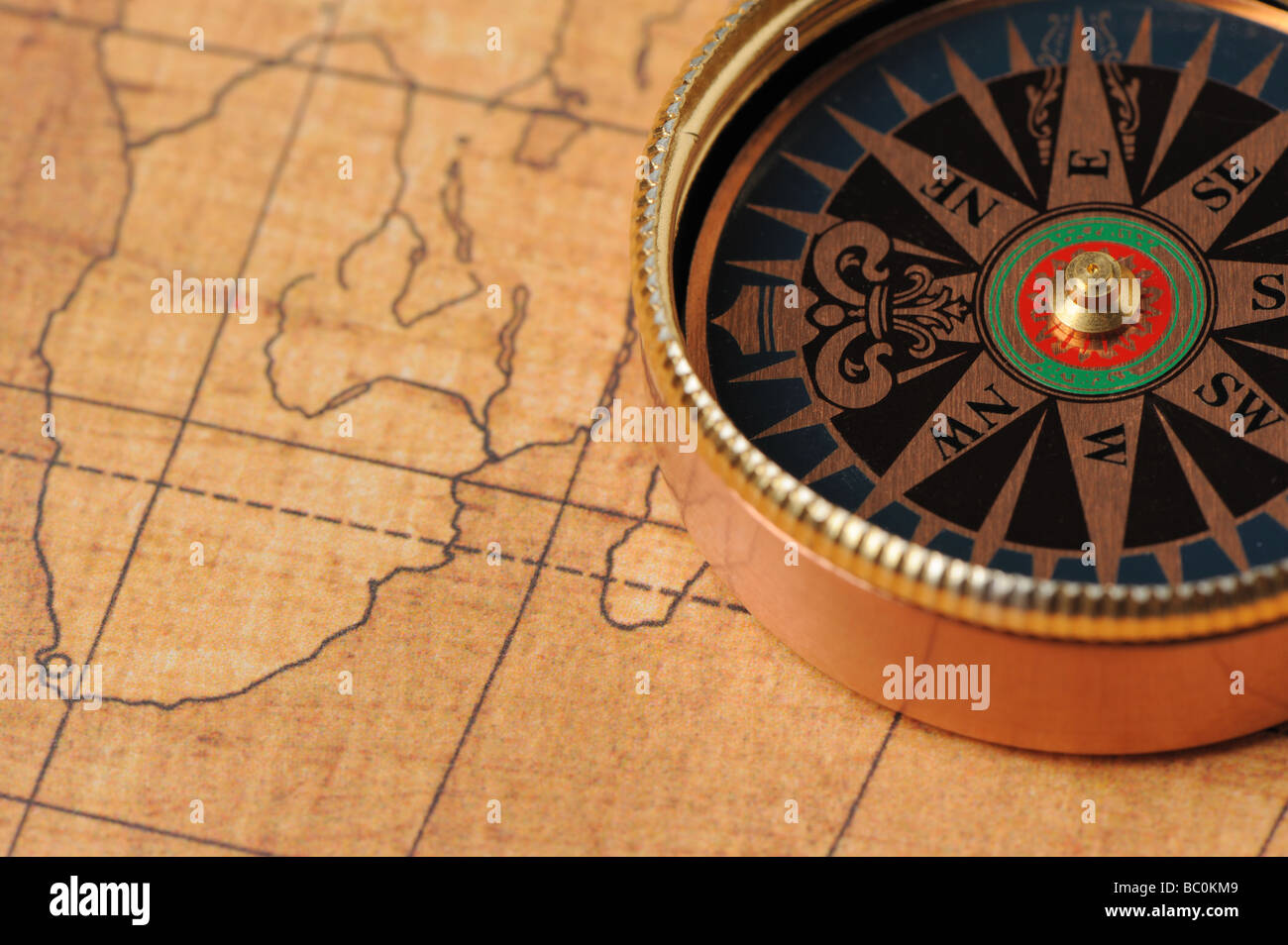 Old compass and map background Old gold color Stock Photo - Alamy