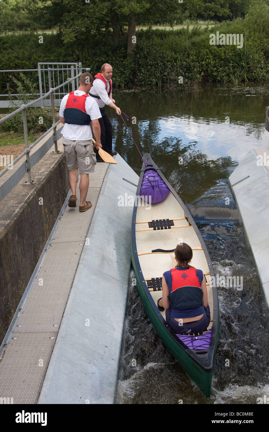 canadian canoeists fish pass canoeing canoe river medway kent england ...
