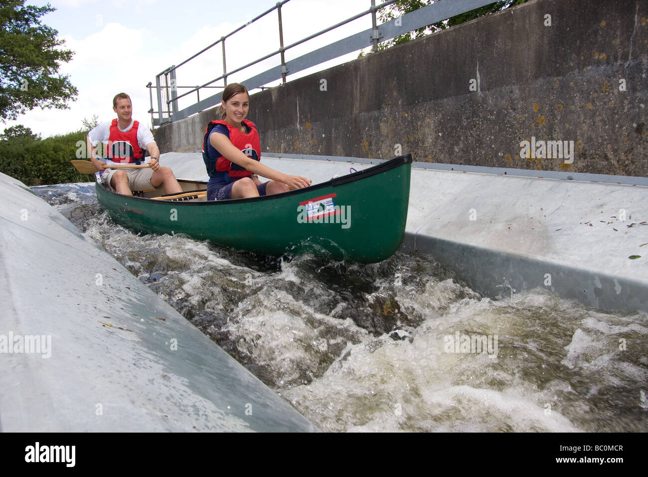 canadian canoeists fish pass canoeing canoe river medway kent england ...