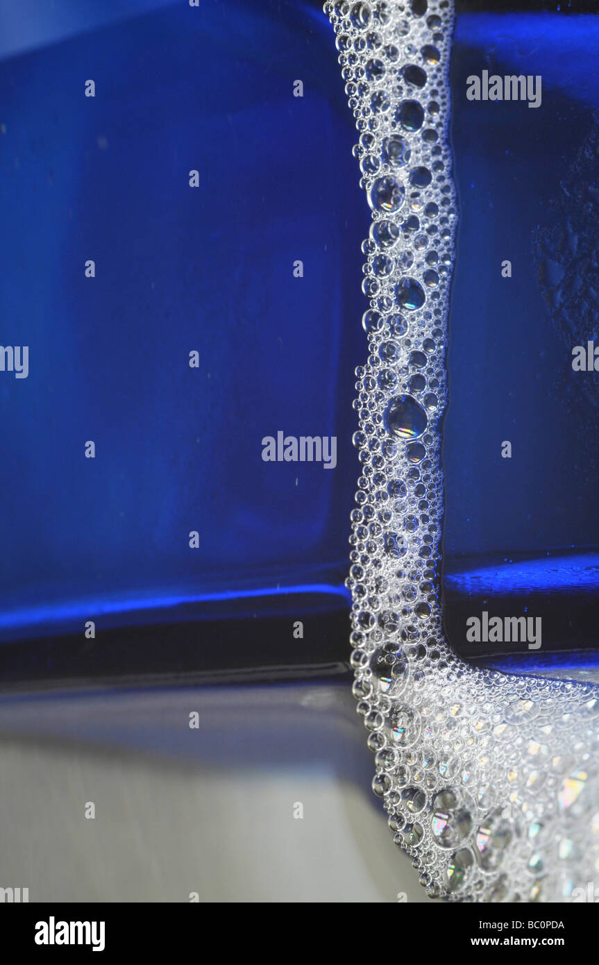 Abstract of a stream of frothy bubbles against blue Stock Photo - Alamy