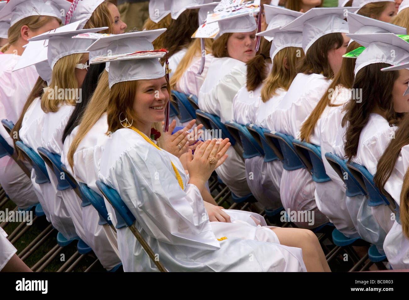 Graduation ceremony, female high school students in cap and gown Stock ...