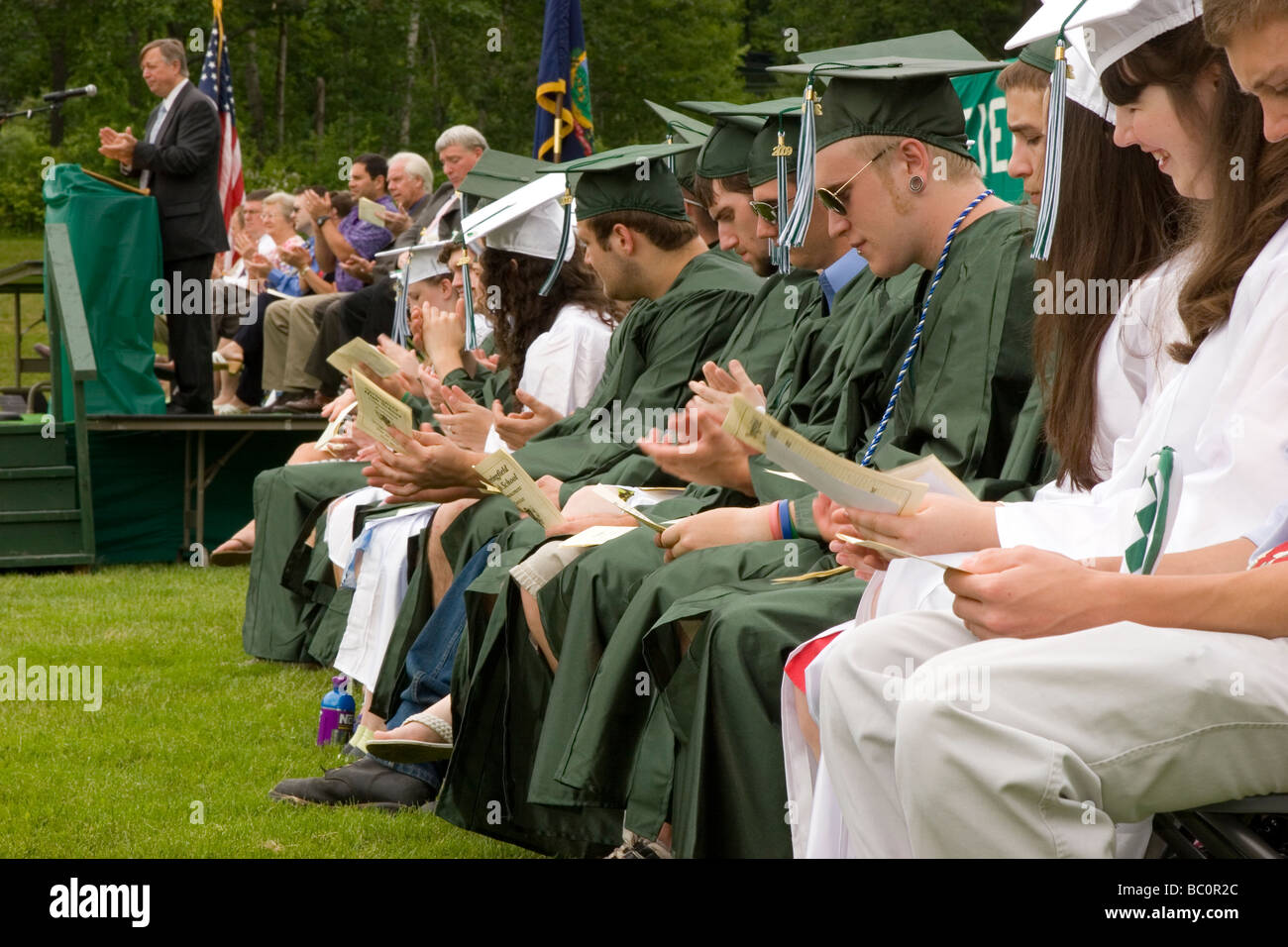 Graduation ceremony, high school students in cap and gown Stock Photo ...