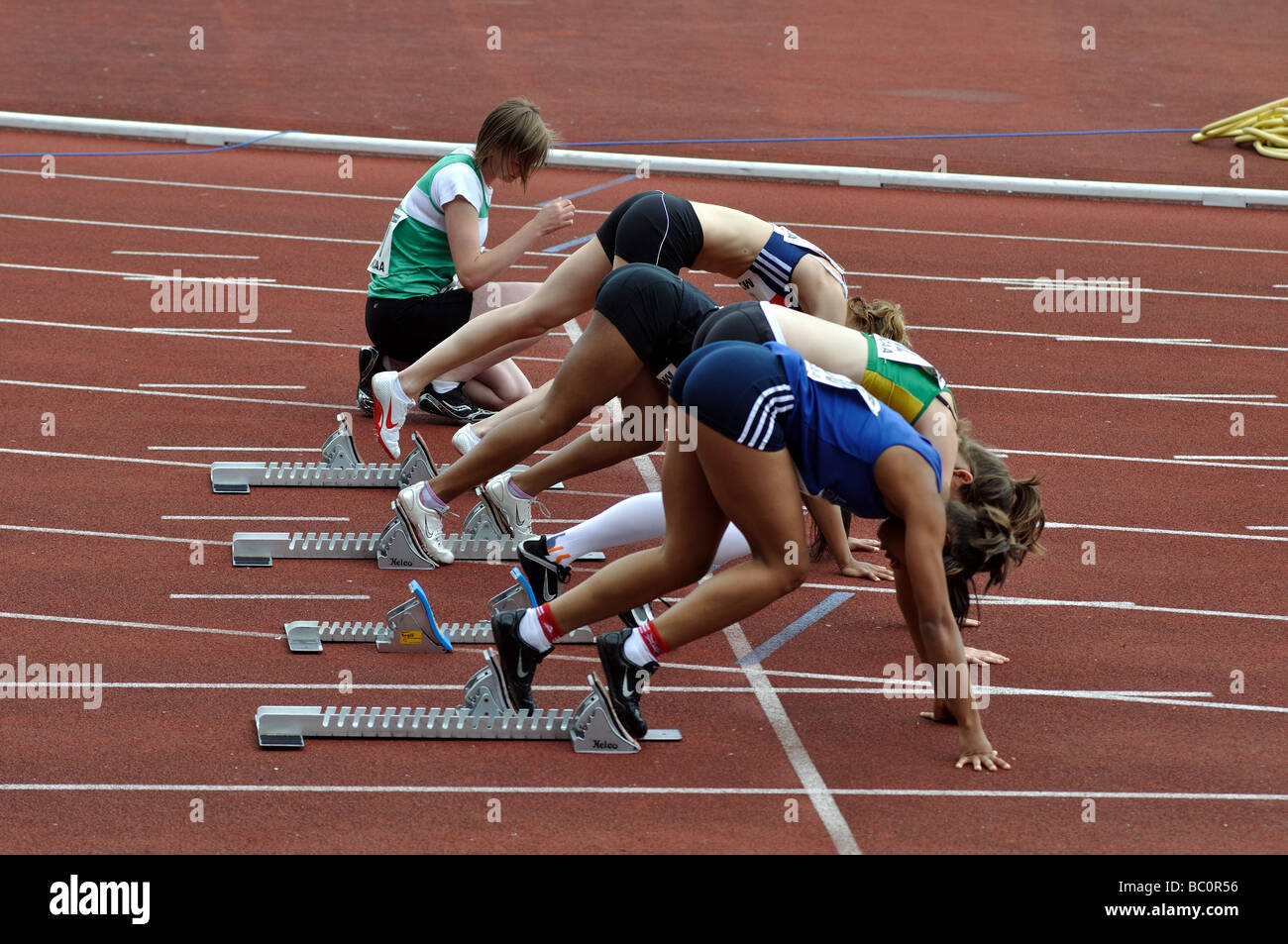 Female athletes in starting blocks hi-res stock photography and images ...