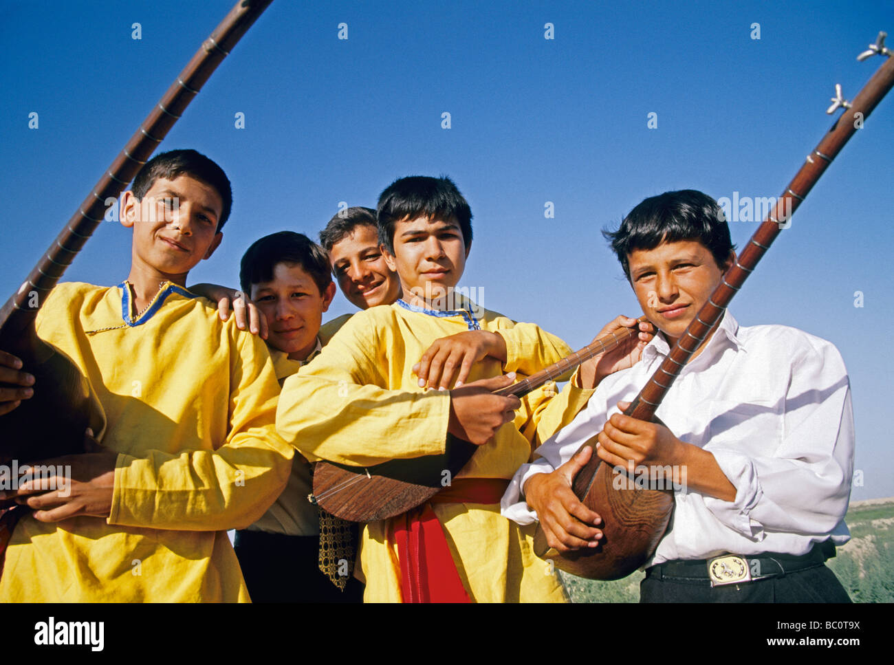 Turkmen students with musical instruments in traditional costume for ...