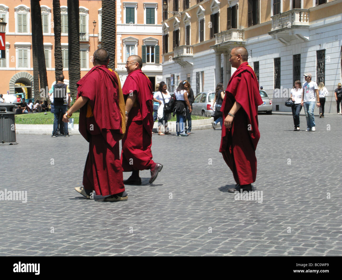 tibetan monks walking in street in rome italy Stock Photo - Alamy