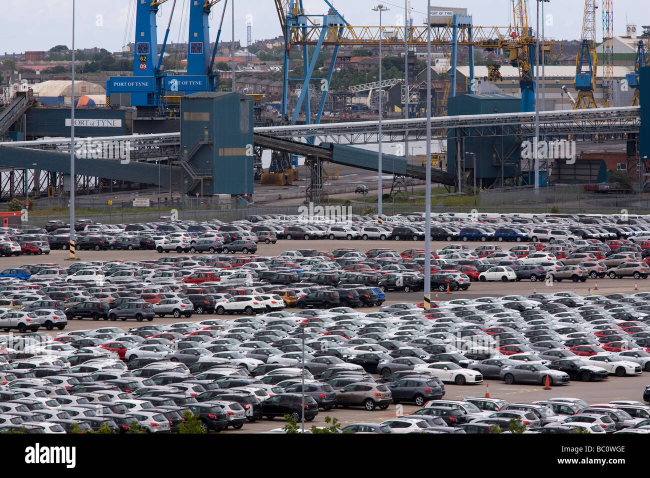 Lines of cars wait to be loaded onto ship for export from the UK Stock ...