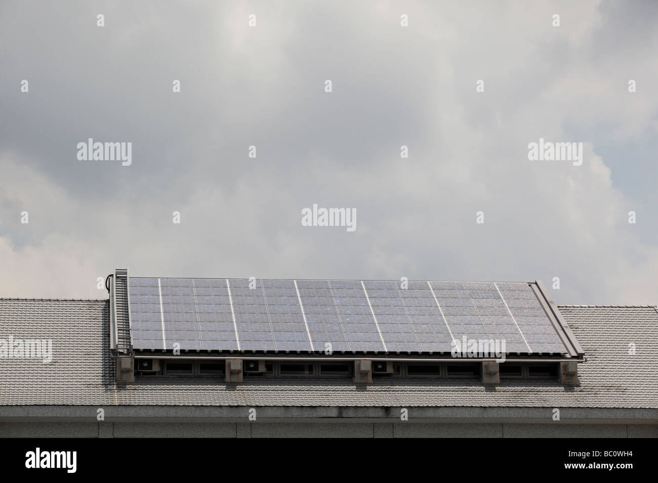 Solar power plate is installed on the roof of modern building Stock ...