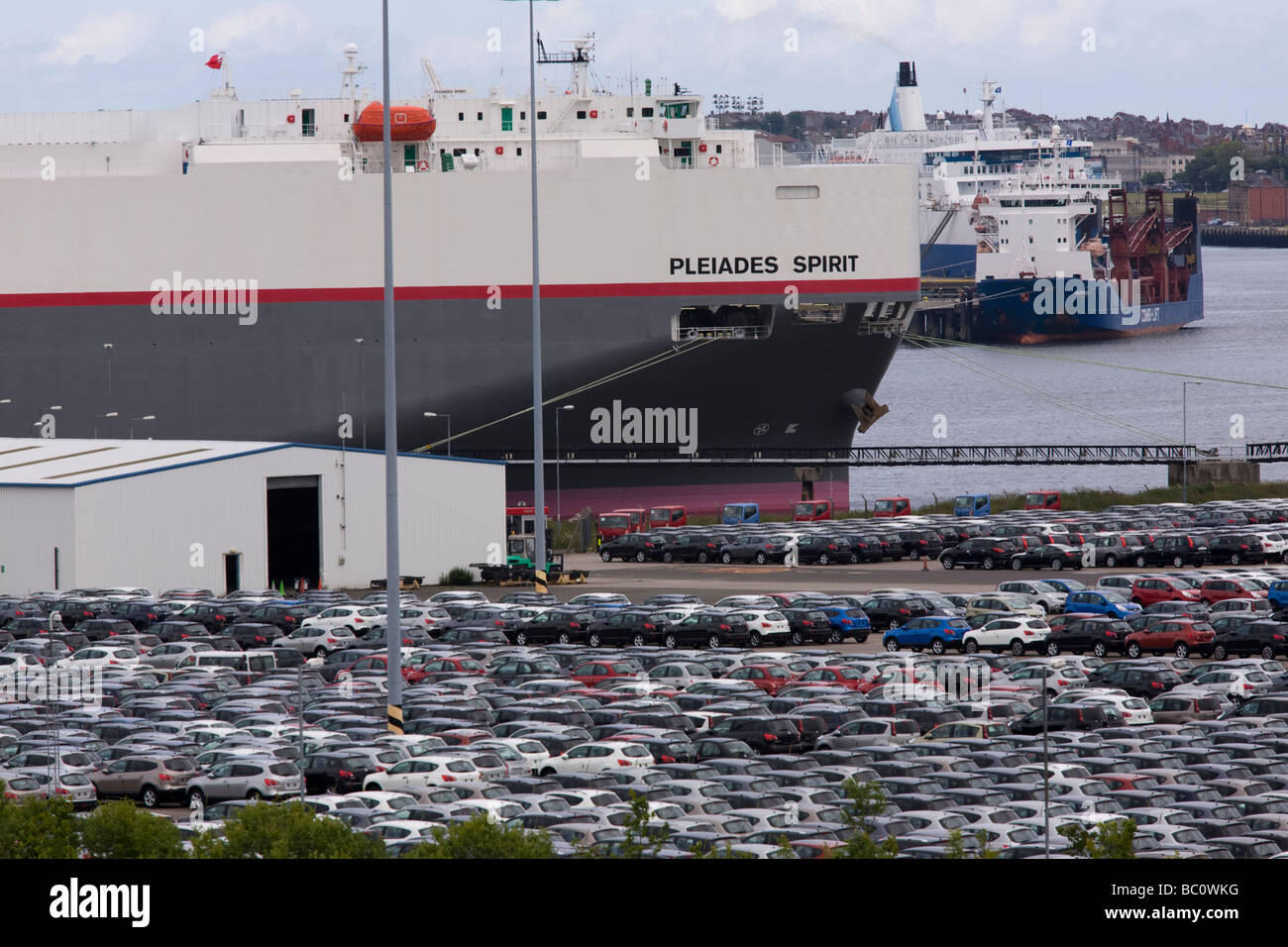 Lines of cars wait to be loaded onto ship for export from the UK Stock ...