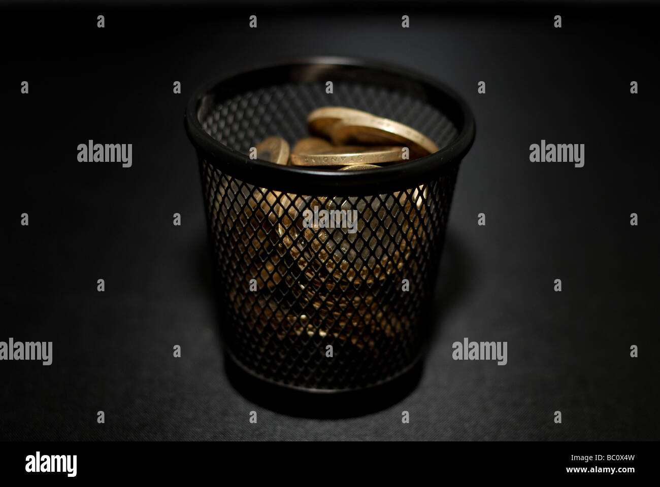 Two Pound Coins Fallen Out Of A Pot Stock Photo - Alamy