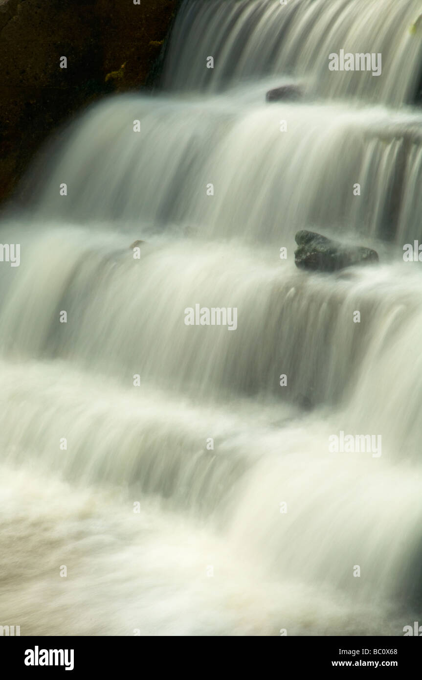 Fresh water cascading down over a waterfall on Mousehole beach in ...