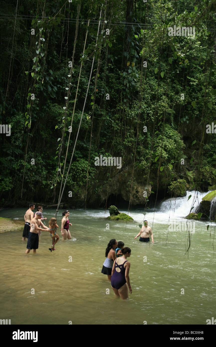 Tourists wadding in one of the pools of the YS falls in Jamaica Stock ...