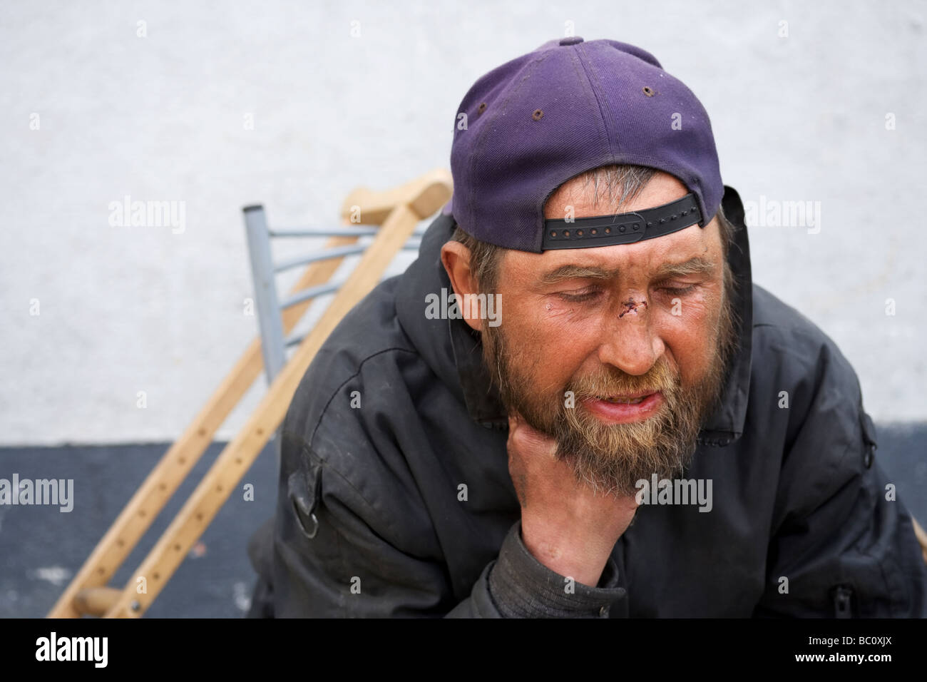 Disabled homeless man on a city street Stock Photo - Alamy