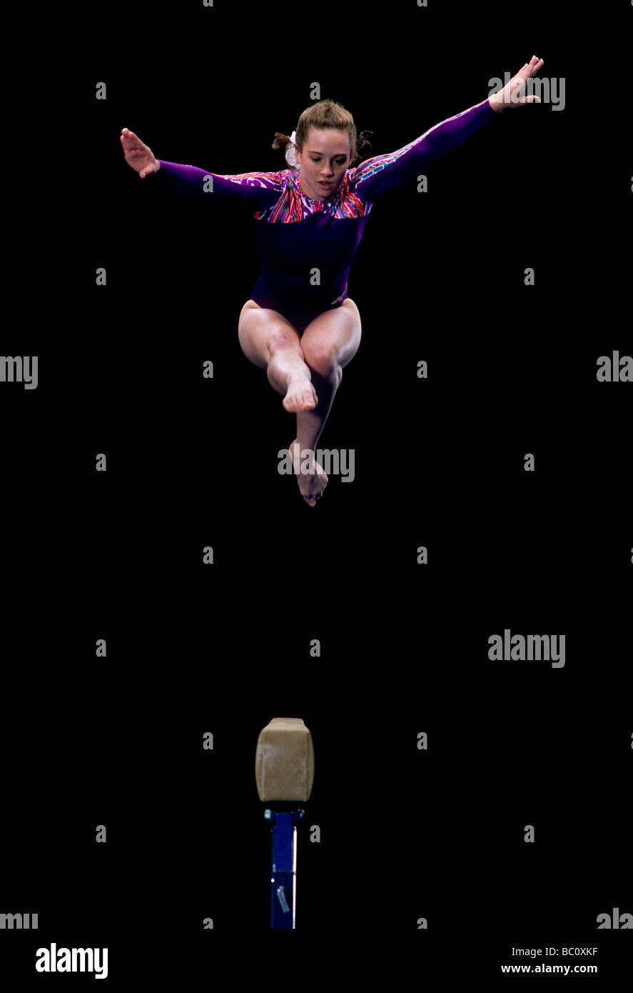 Gymnast jumping on beam hi-res stock photography and images - Alamy