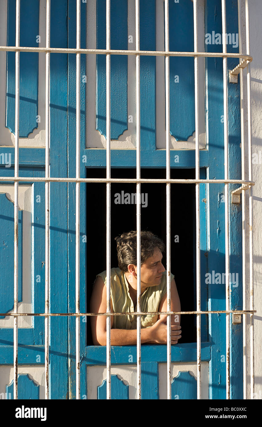 Cuban man at the window to his home in Trinidad, Cuba Stock Photo - Alamy