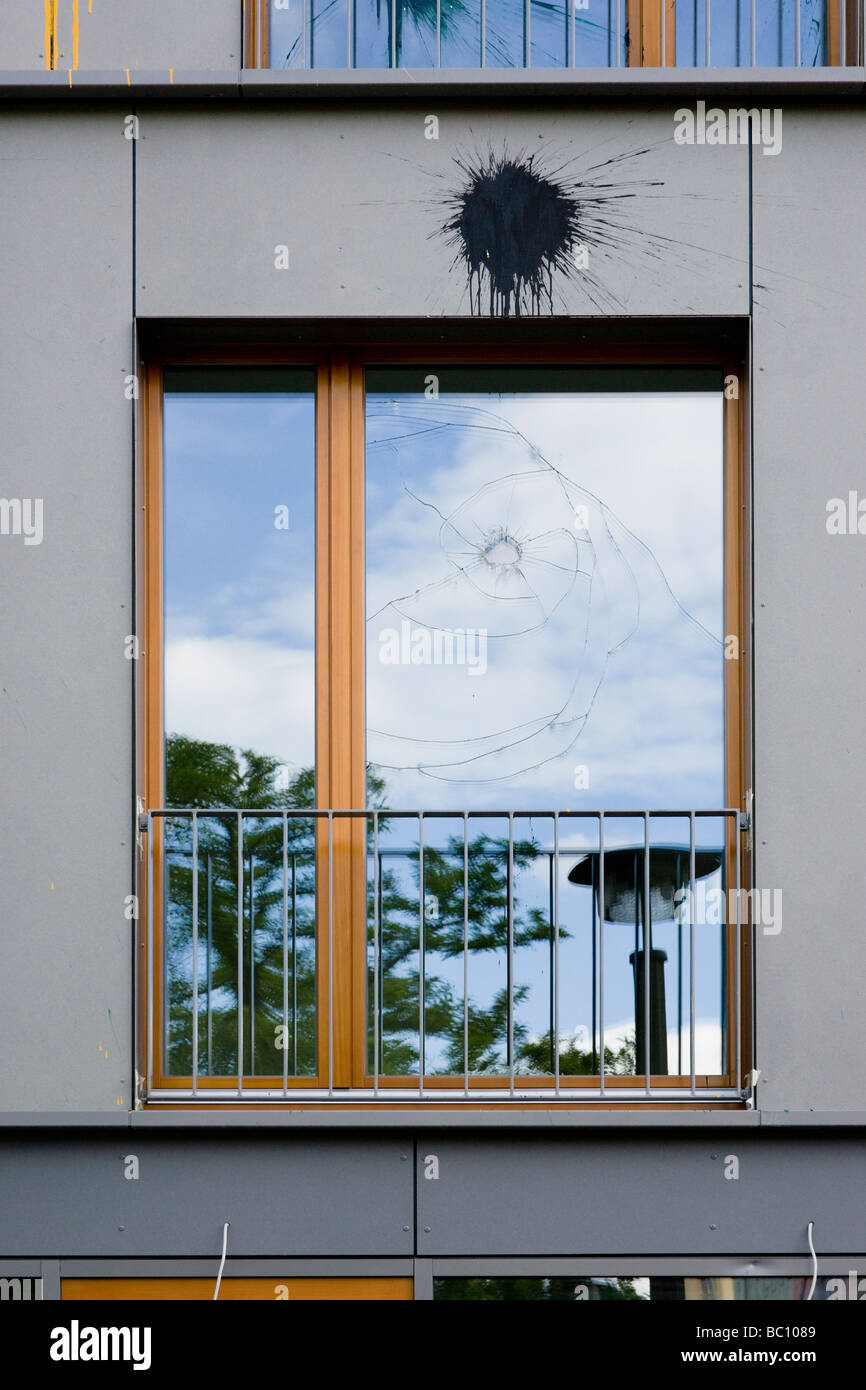 Fassade broken window paint bomb hi-res stock photography and images ...