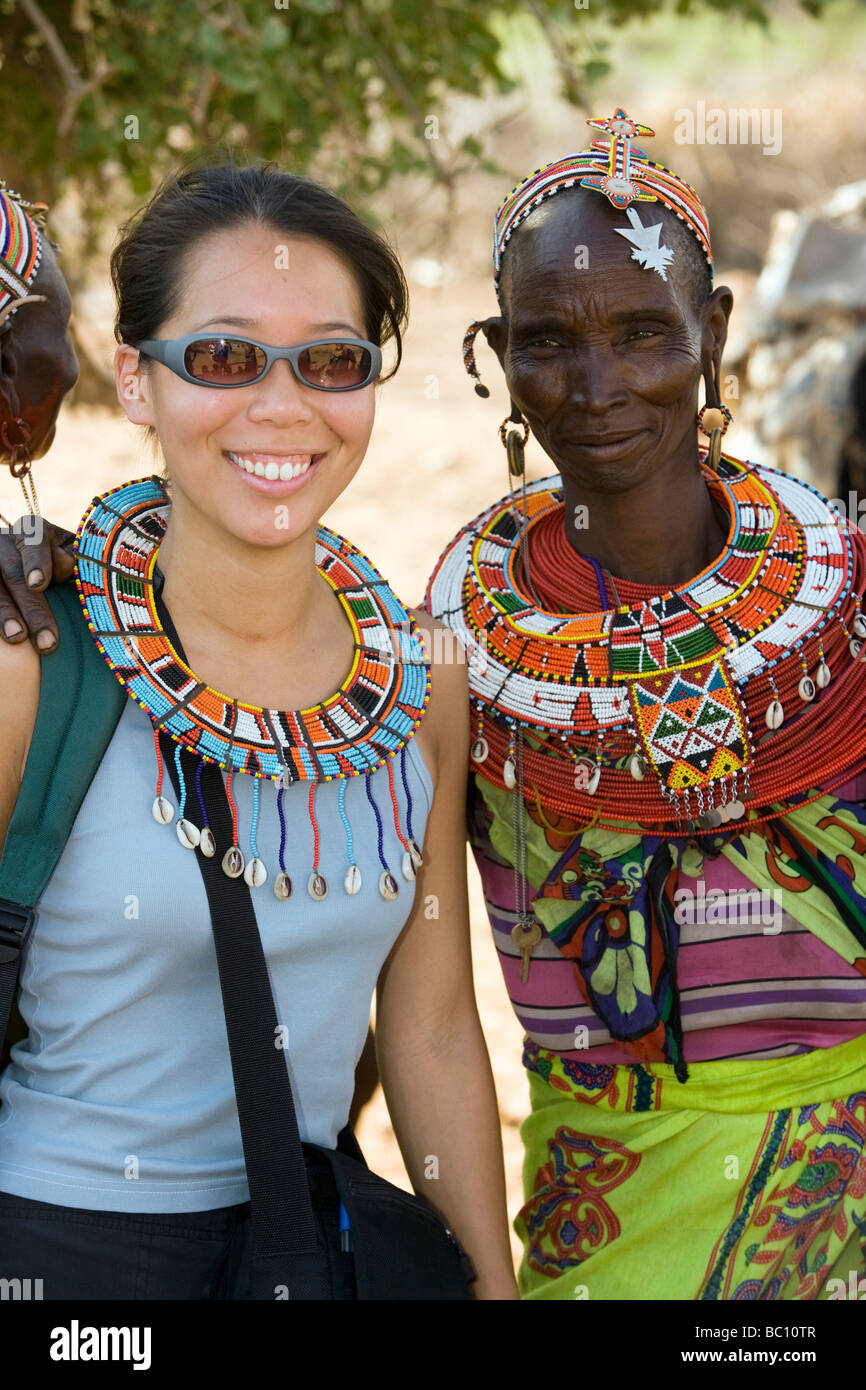 Samburu woman with young tourist - Samburu Village - near Buffalo ...