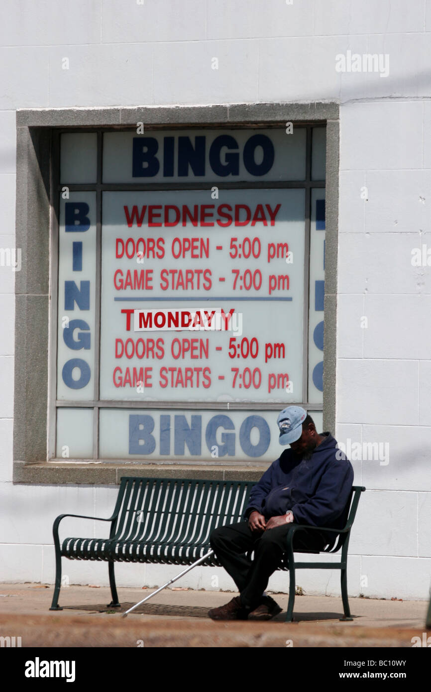 Man in front of Bingo sign Stock Photo - Alamy