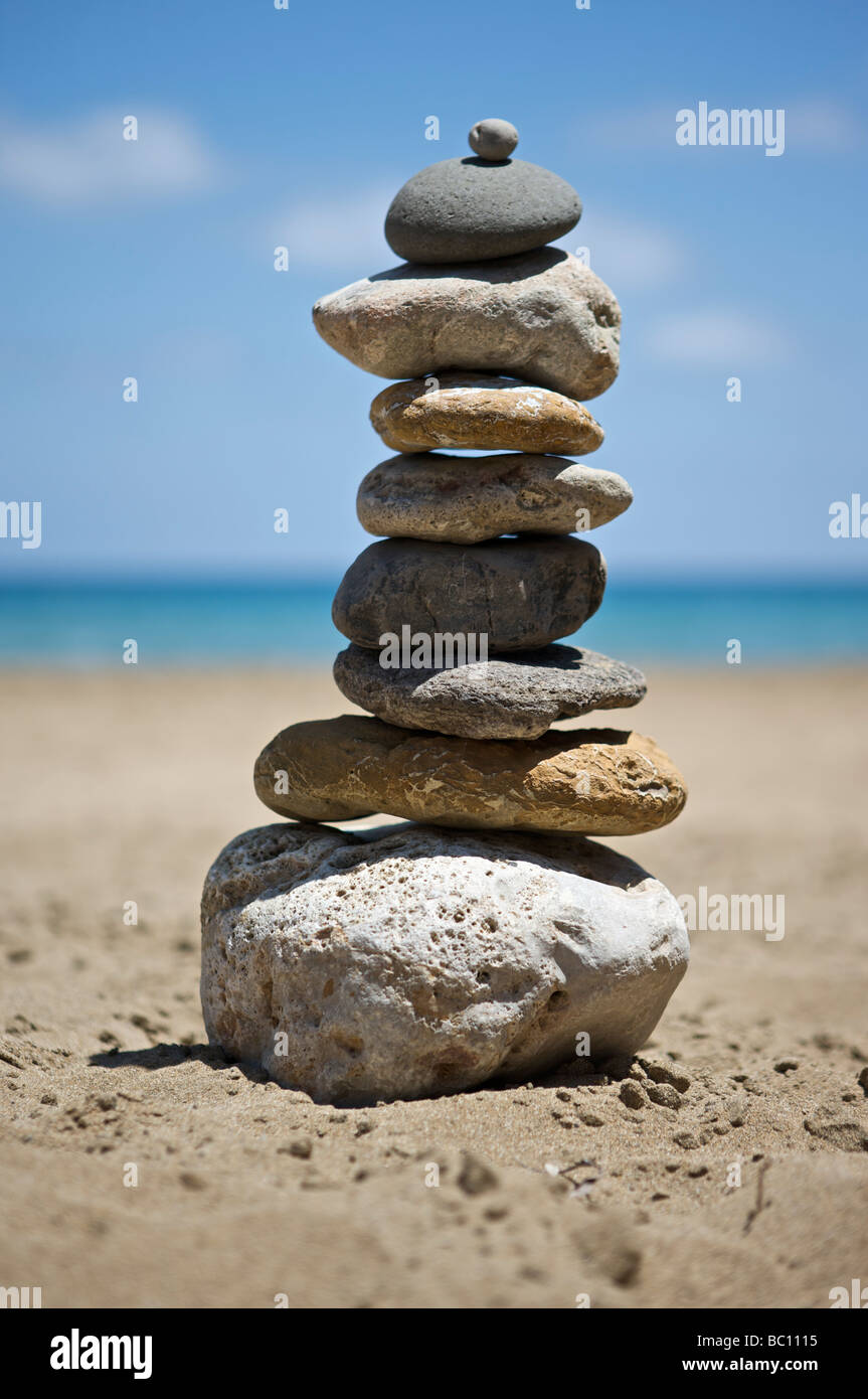 rock pile art , on sunny ibiza beach , blue skies , balearic islands ...