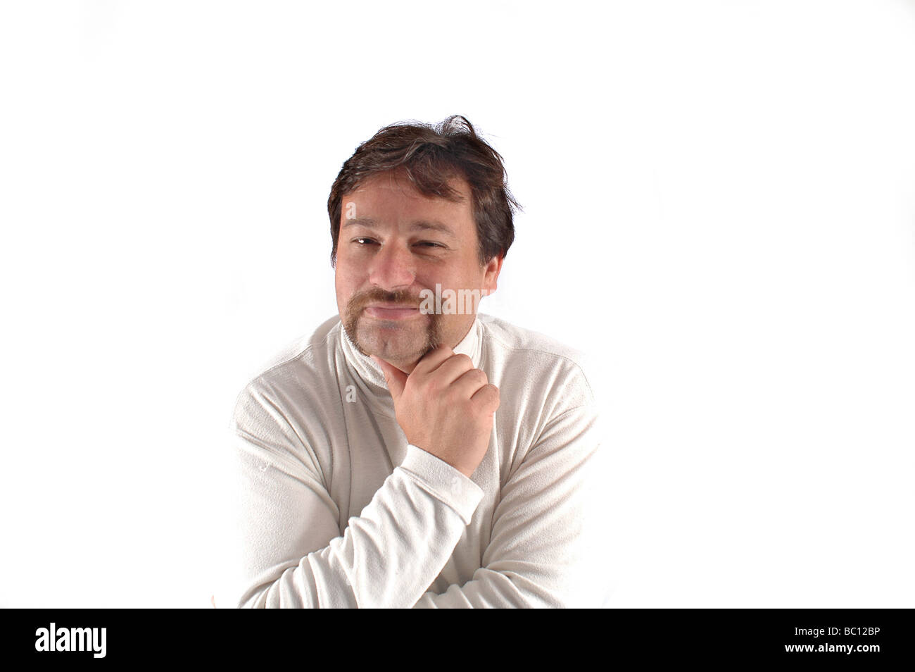 Male model with Moustache smiles at a Studio Shoot into the Camera ...