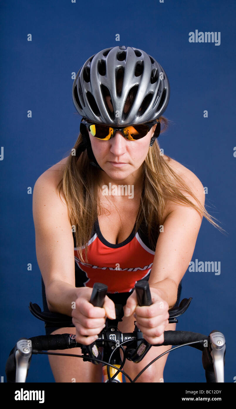 Woman on racing cycle Stock Photo - Alamy