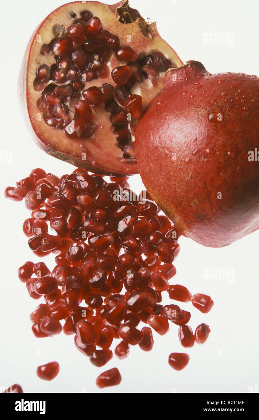 pomegranate split with seeds Stock Photo - Alamy