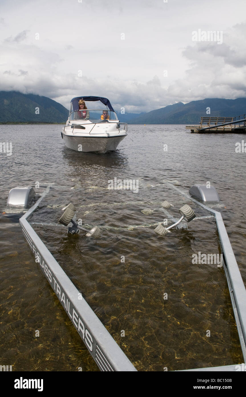 Driving boat on trailer at Moana boat ramp, Lake Brunner Stock Photo ...
