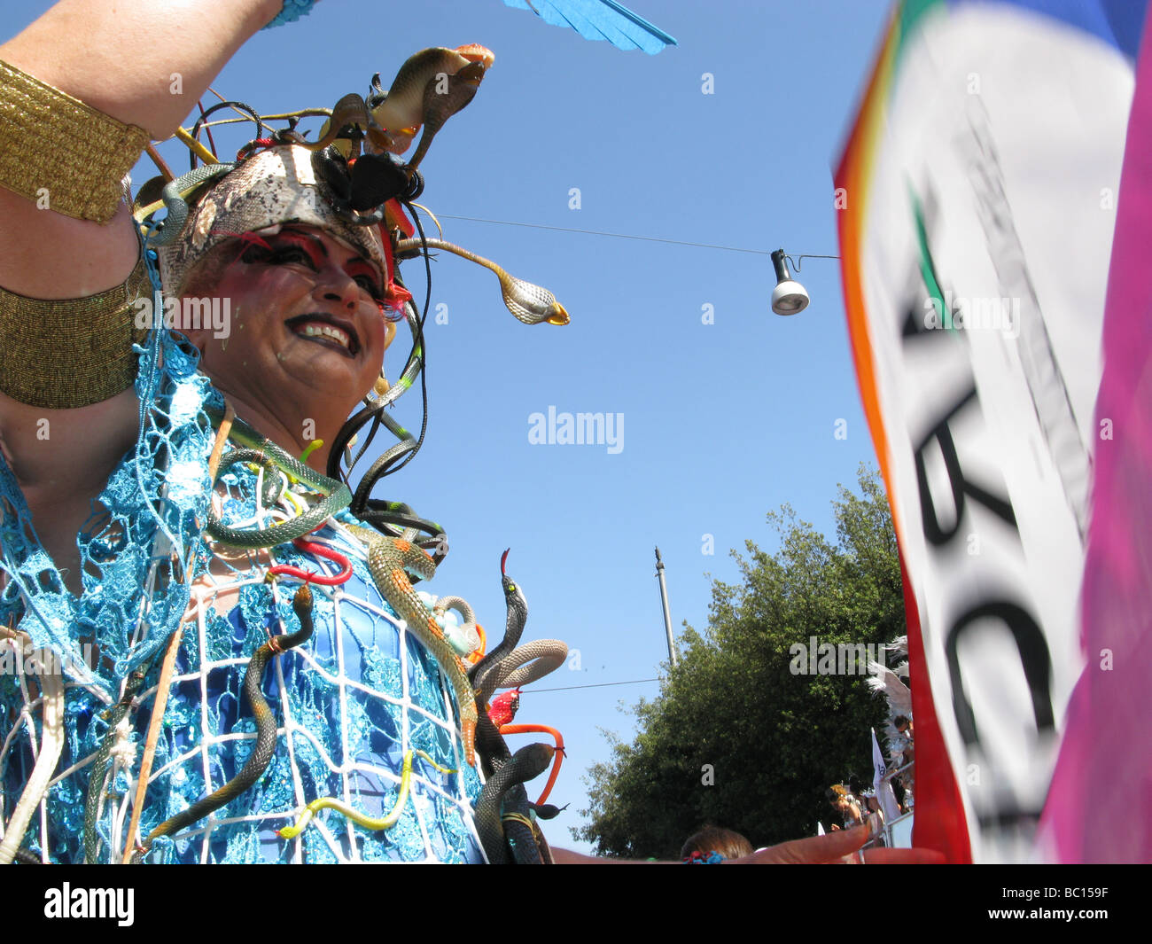 person with snakes fancy dress costume at gay pride rally, rome 2009 ...