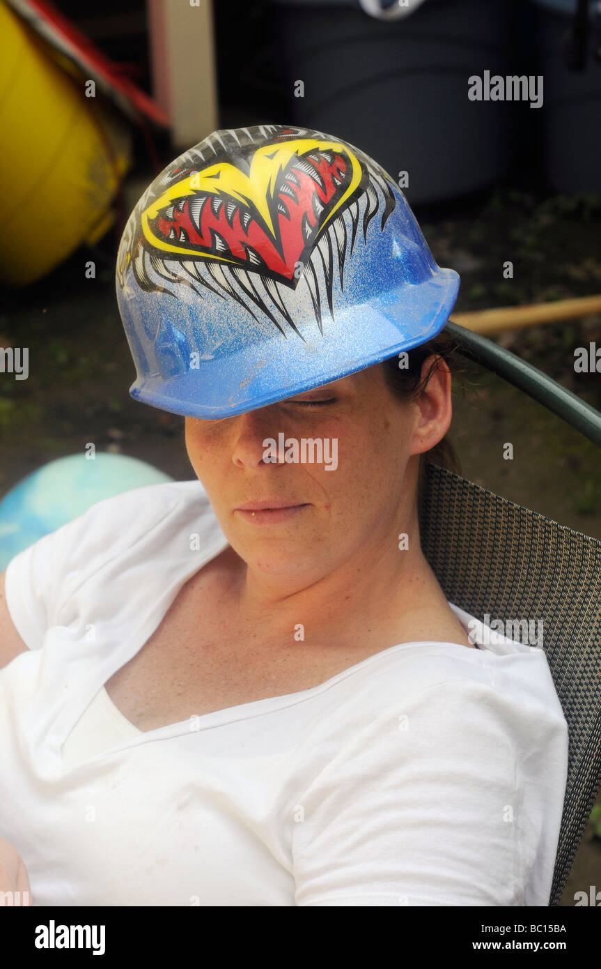 Young woman relaxing on recliner in summer sun Stock Photo - Alamy
