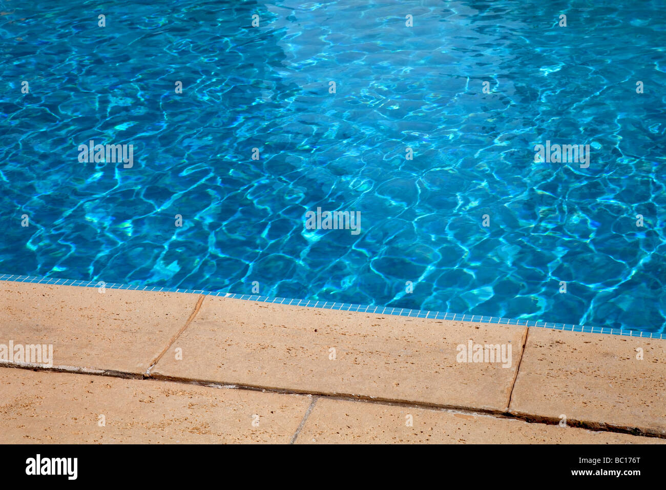 swimming pool blue water detail in summer time Stock Photo - Alamy