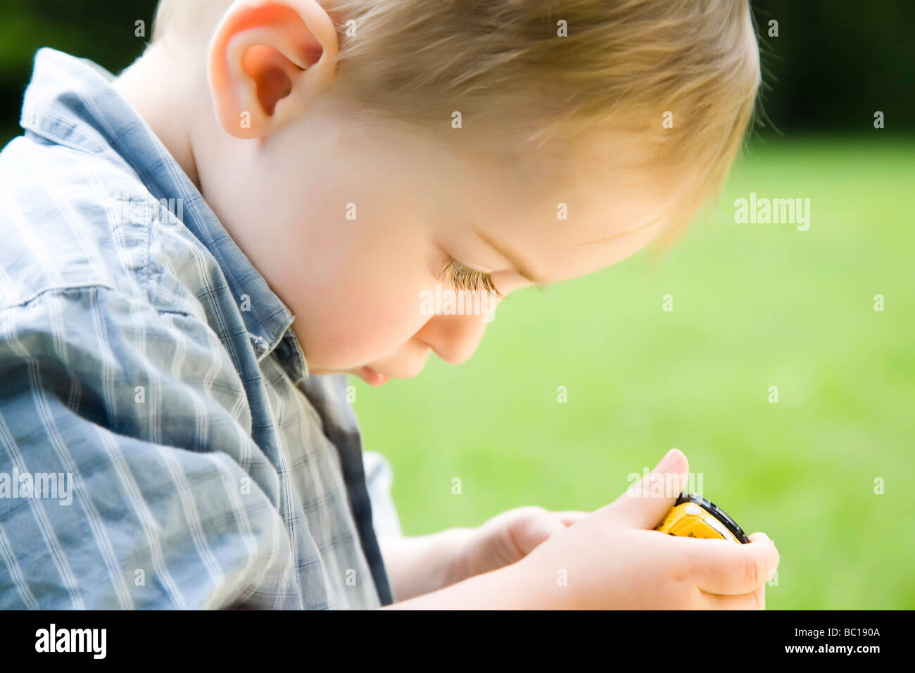 Happy Little Boy Side View Stock Photo - Alamy