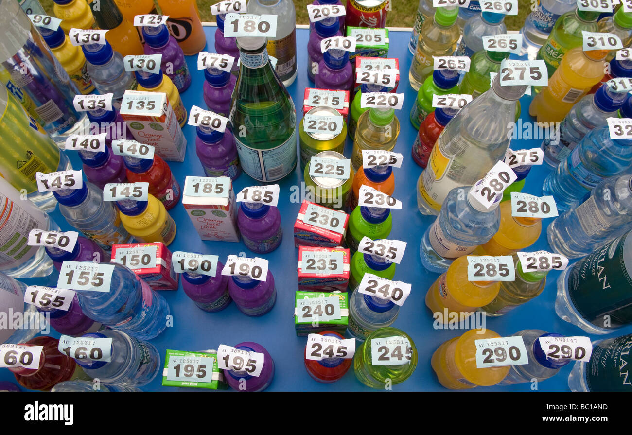 Raffle tickets on top of beverage bottles at a summer fete, Surrey UK ...