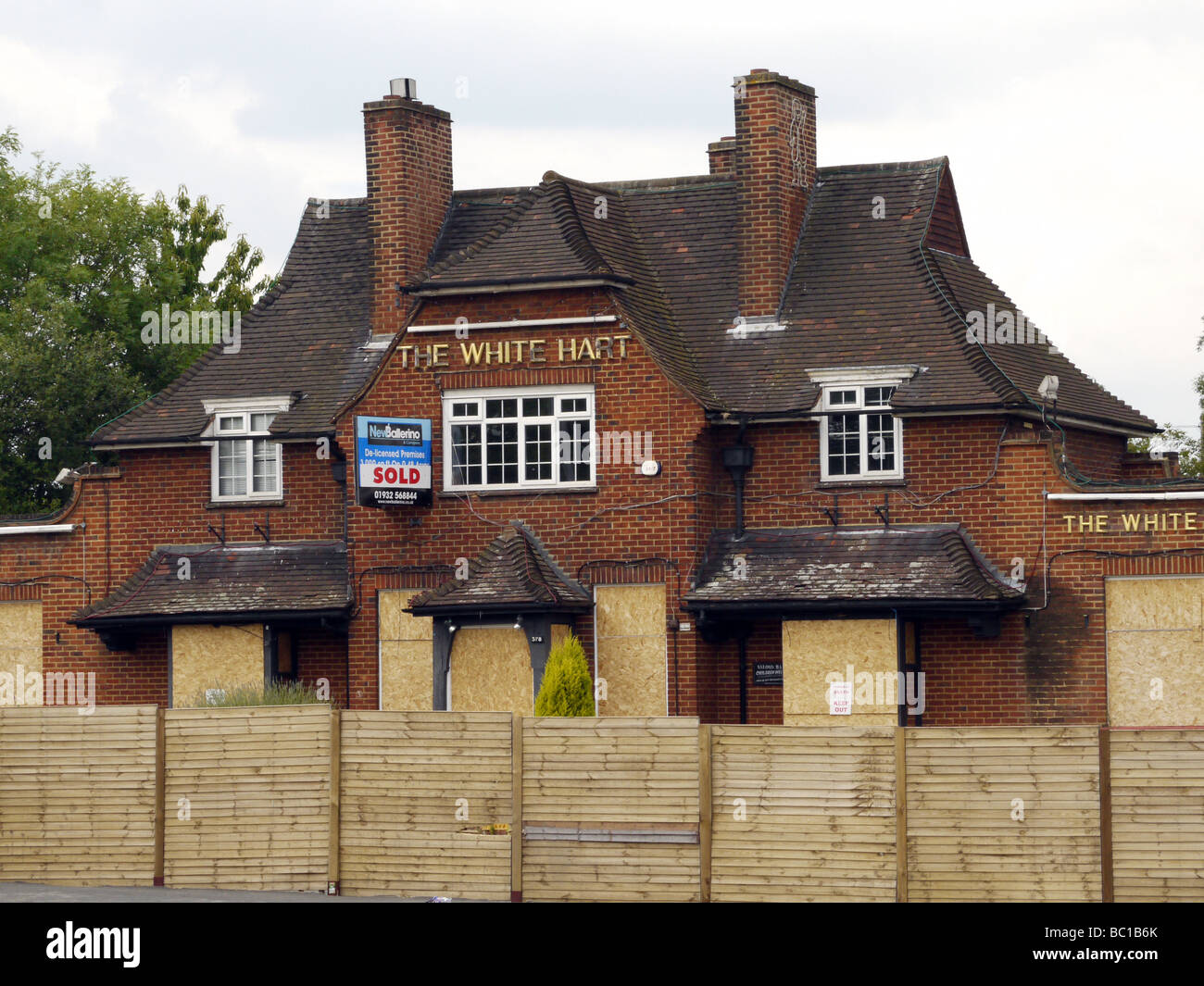 White Hart pub in Chessington Surrey UK with a sold sign de-licenced ...