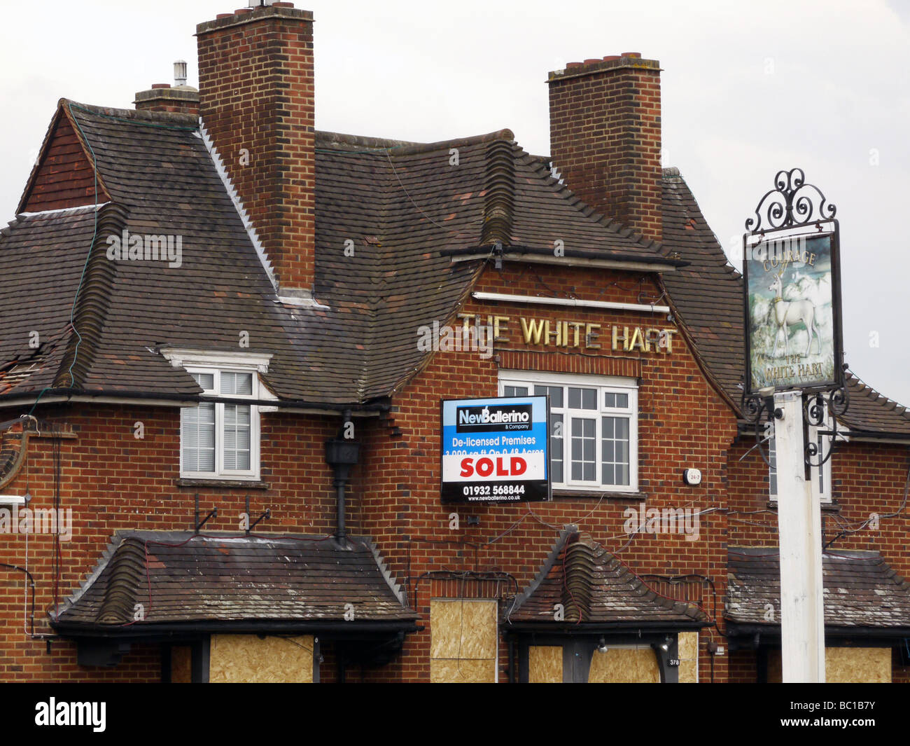 White Hart pub in Chessington Surrey UK with a sold sign de-licenced ...