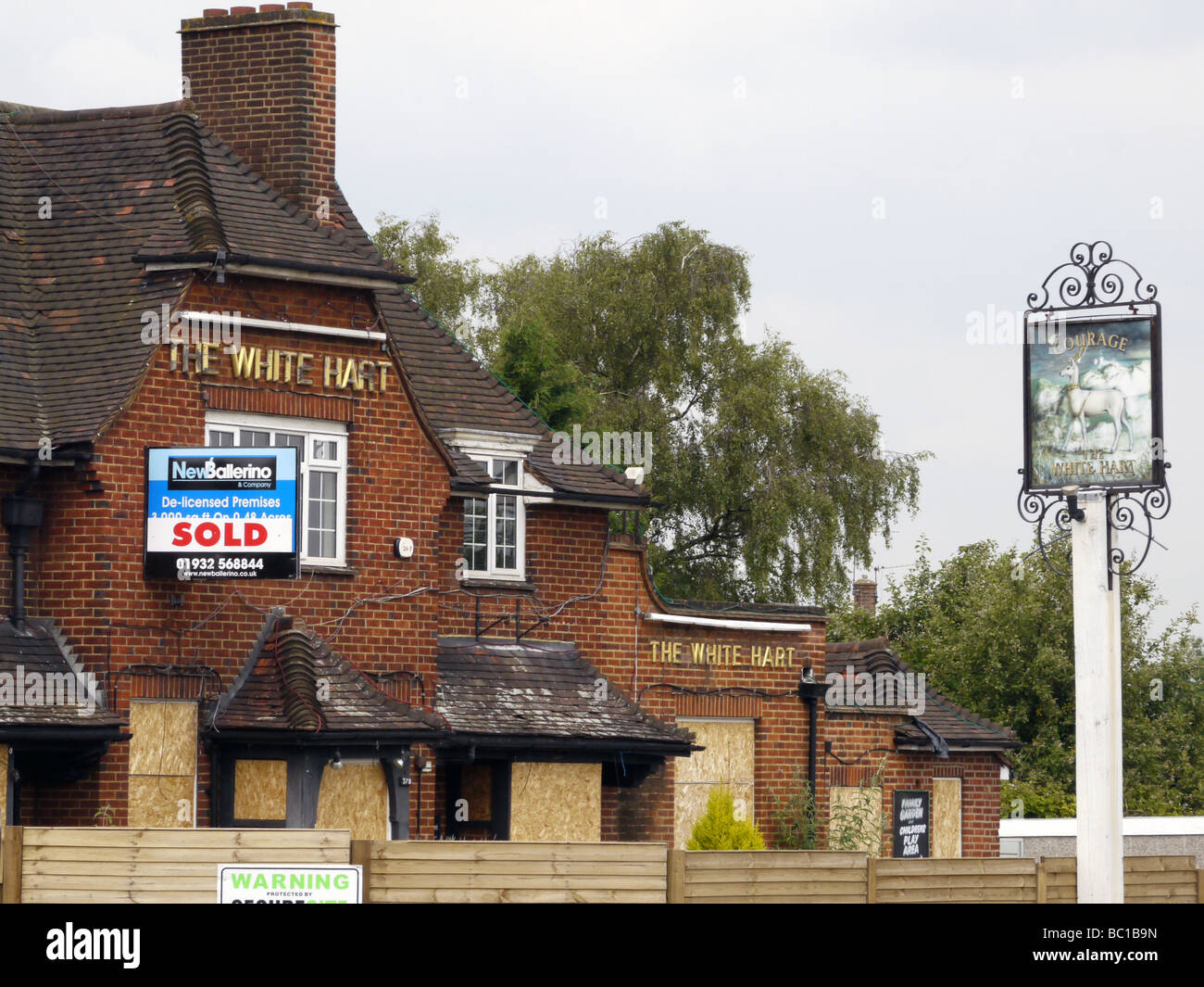 White Hart pub in Chessington Surrey UK with a sold sign de-licenced ...