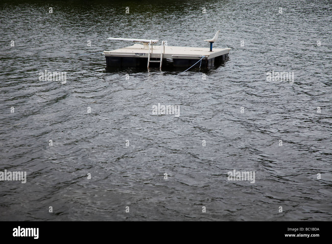 A diving board on a platform in the middle of a lake Stock Photo - Alamy