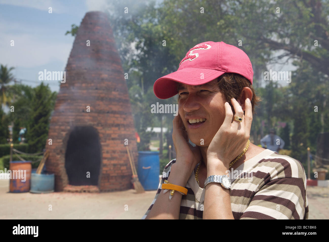 Thai guy blocking out noise hi-res stock photography and images - Alamy