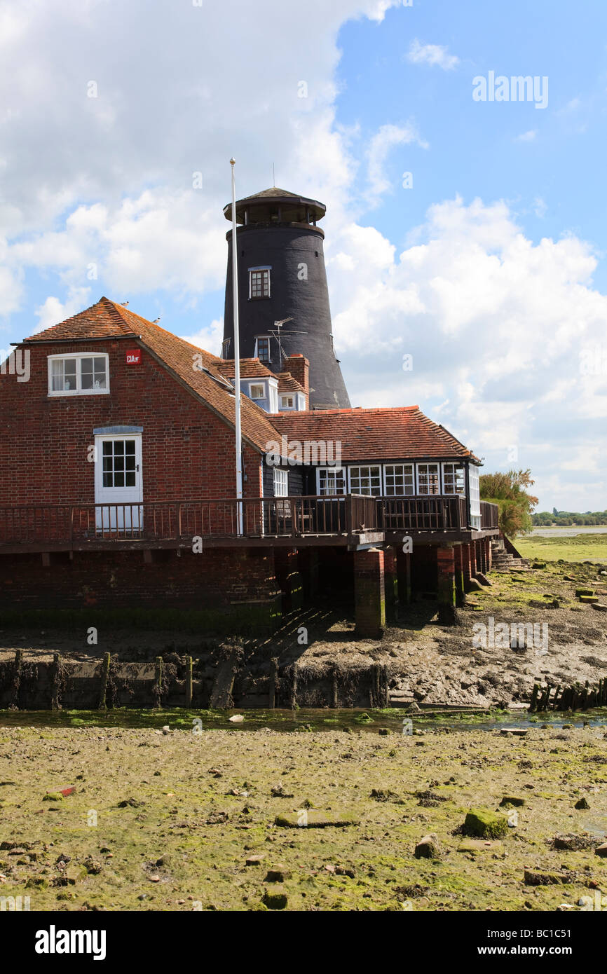 Attractive waterfront mill in the village of Langstone seen at low tide ...