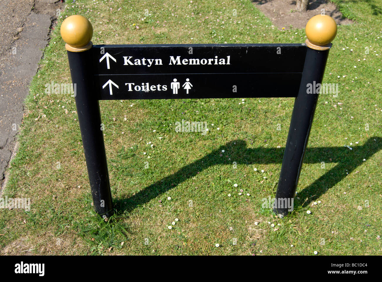 sign with arrow pointing towards the katyn memorial, in gunnersbury ...