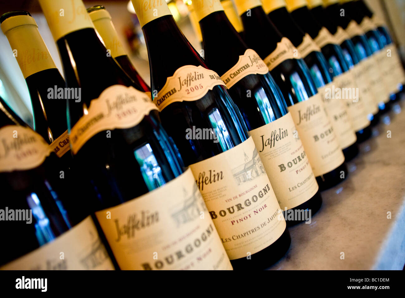 A close up view of a row of French wine bottles Stock Photo - Alamy