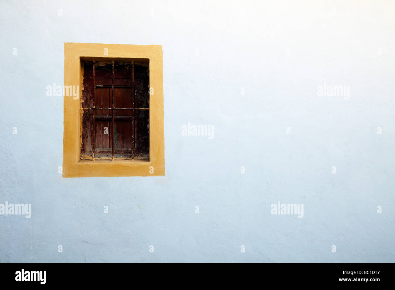 yellow window on white wall Stock Photo - Alamy