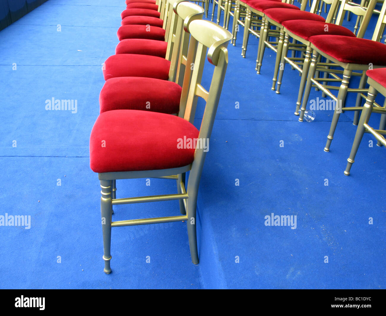 rows of red gold chairs for vip at an outdoor parade event Stock Photo ...