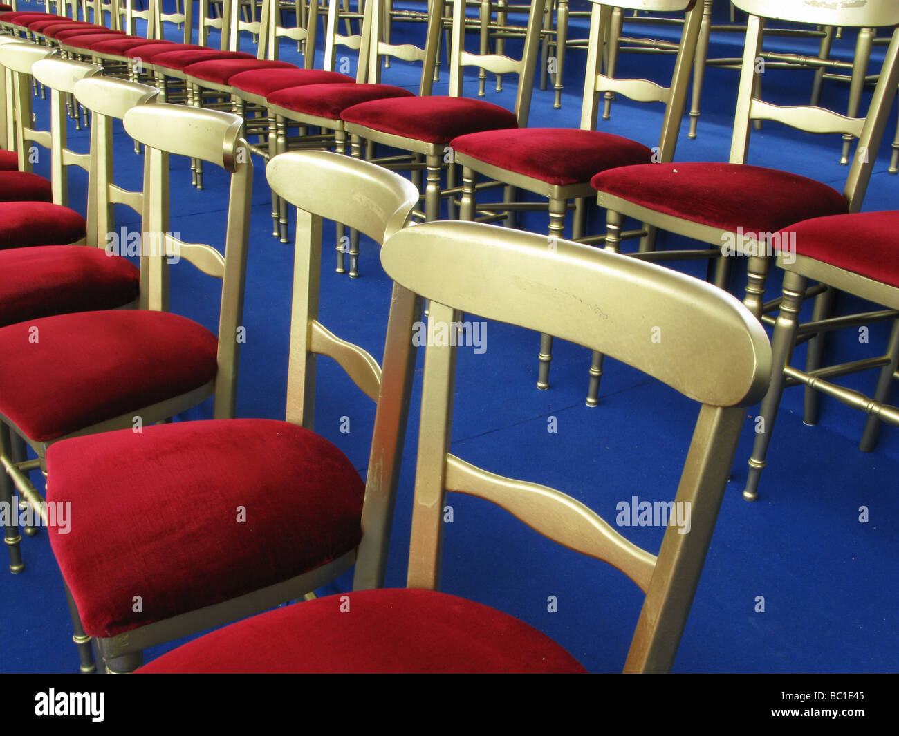 rows of red gold chairs for vip at an outdoor parade event Stock Photo ...